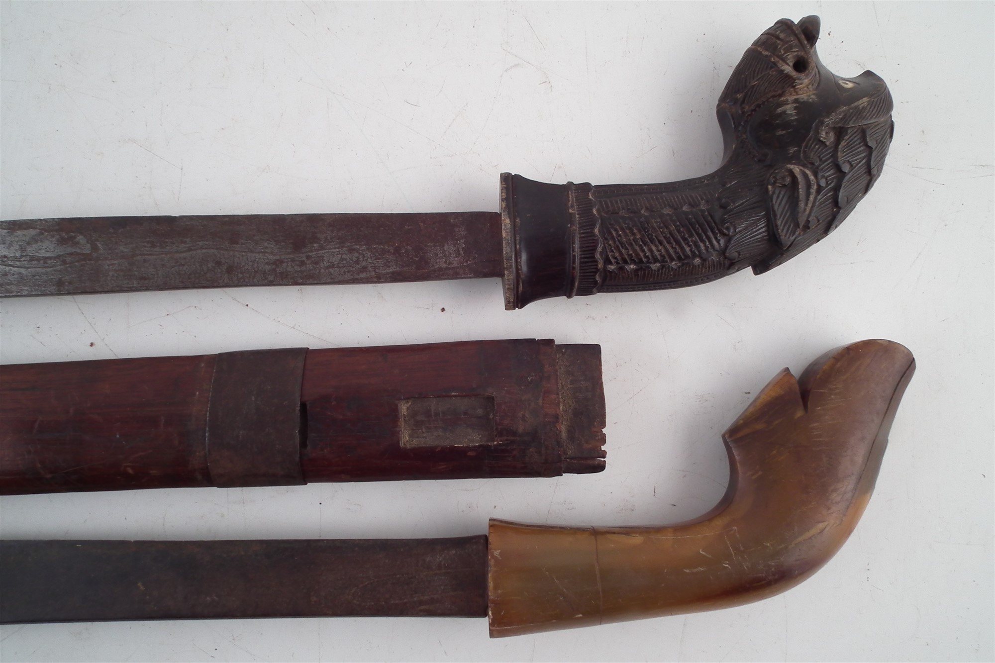 Lot 214 - Two Malay /Indonisian Klewang swords,