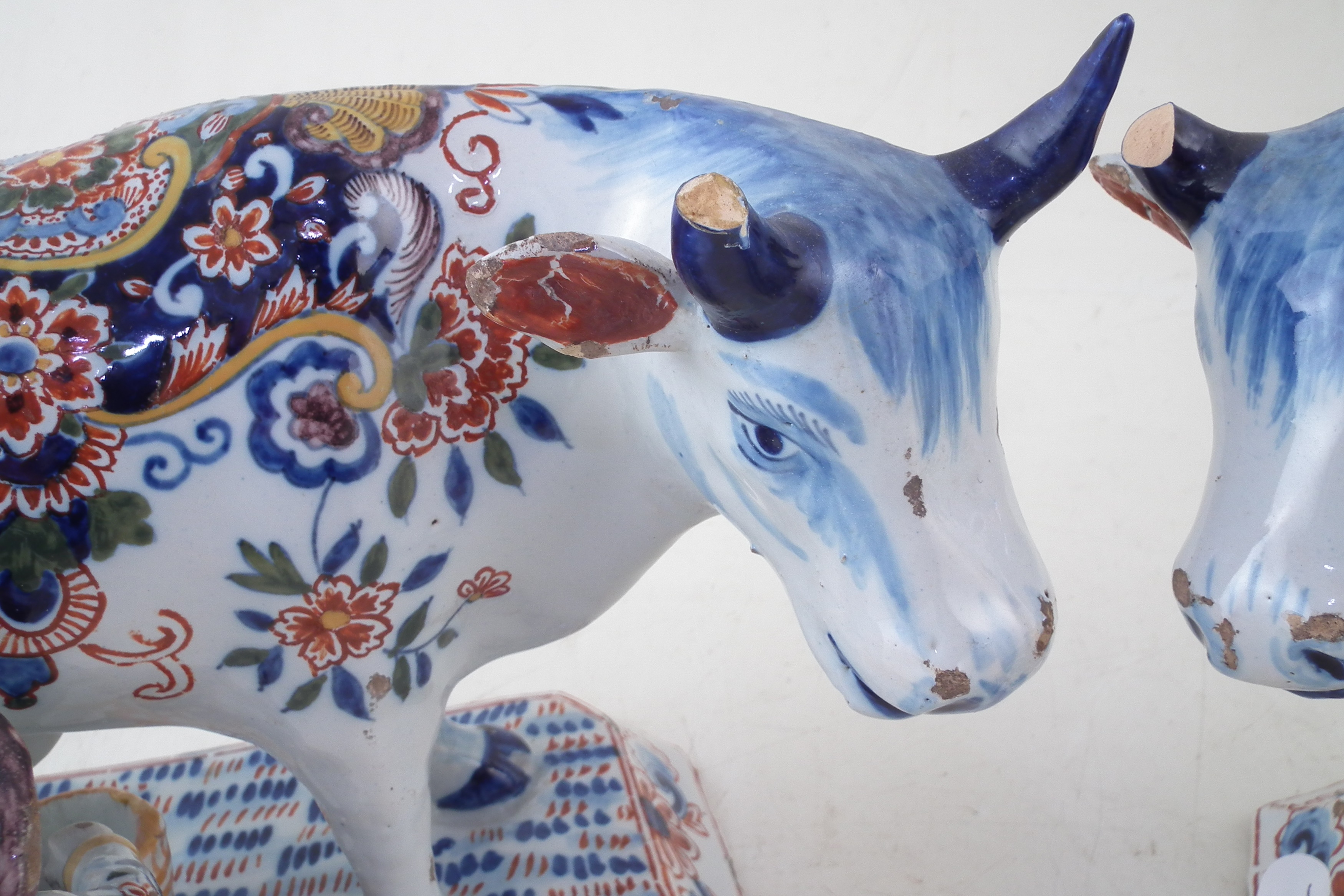 Lot 257 - Pair of Delft cows
