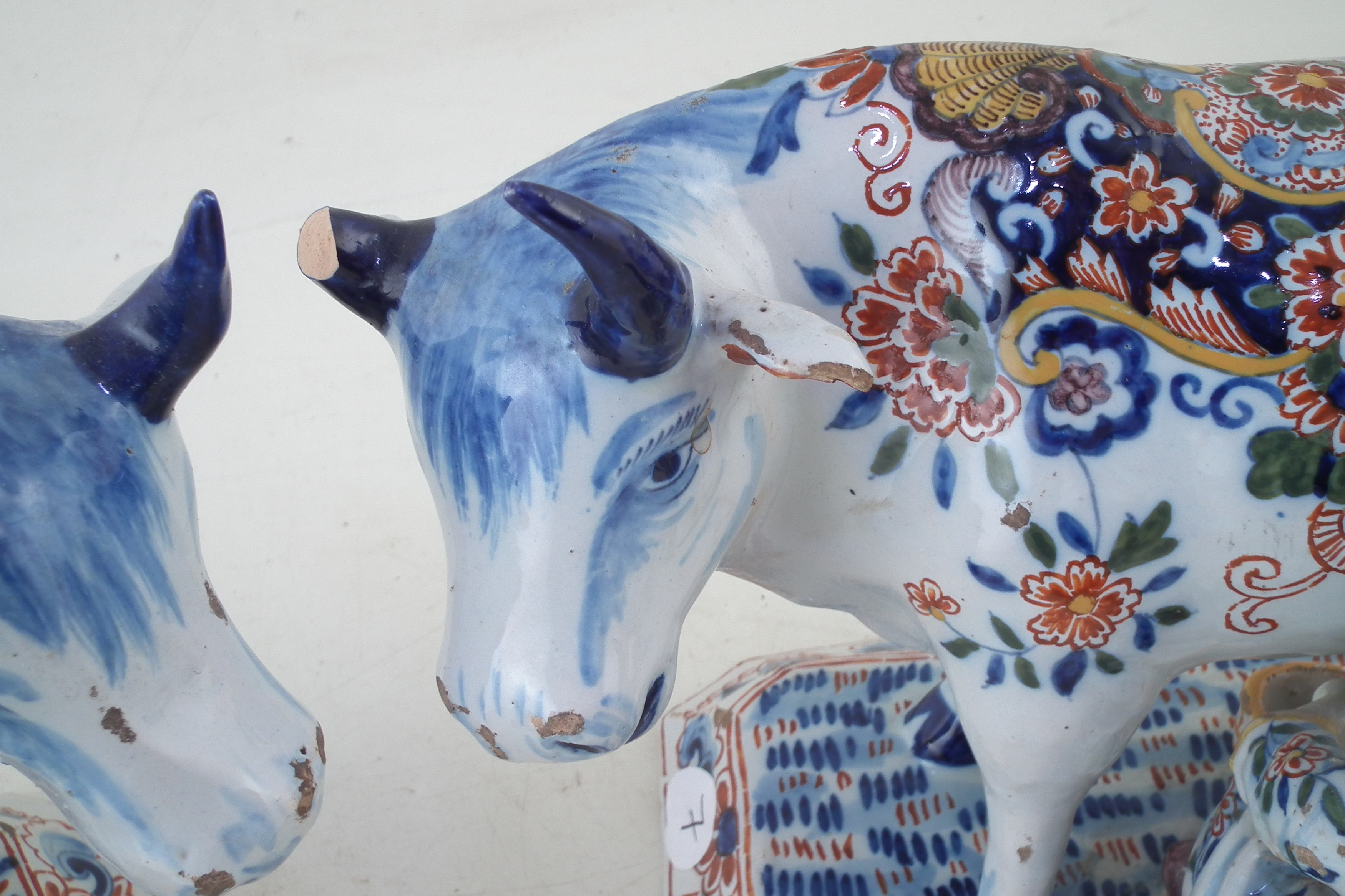 Lot 257 - Pair of Delft cows