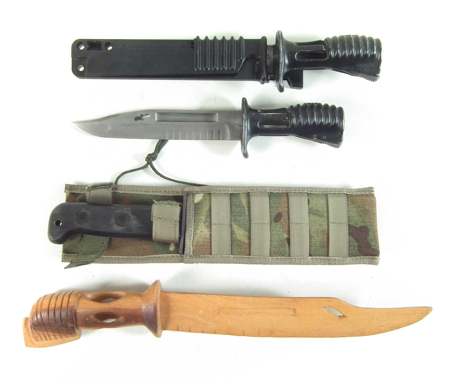 Lot 425 - Two SA80 bayonets, a carved wood copy and a