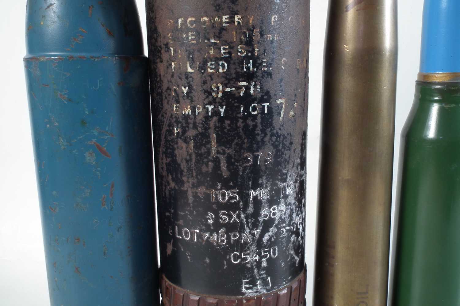 Lot 389 - Two inert shell heads and three artillery