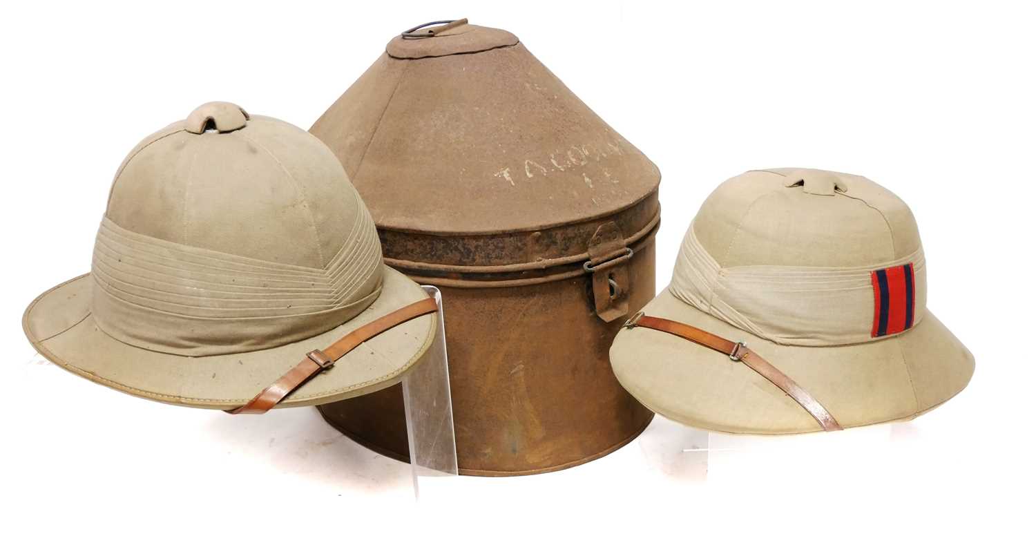 Lot 377 - Two Pith helmets,