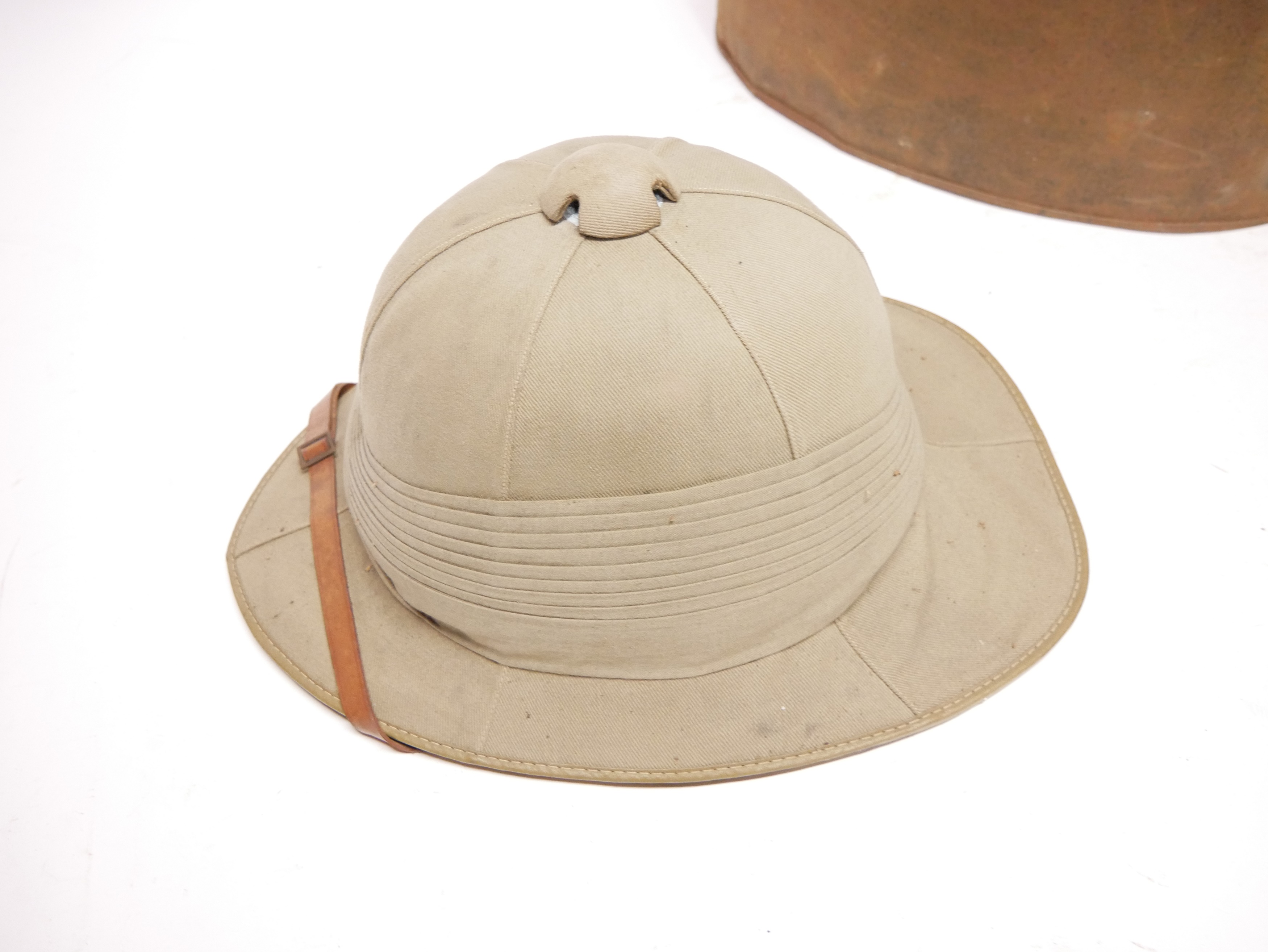 Lot 377 - Two Pith helmets,