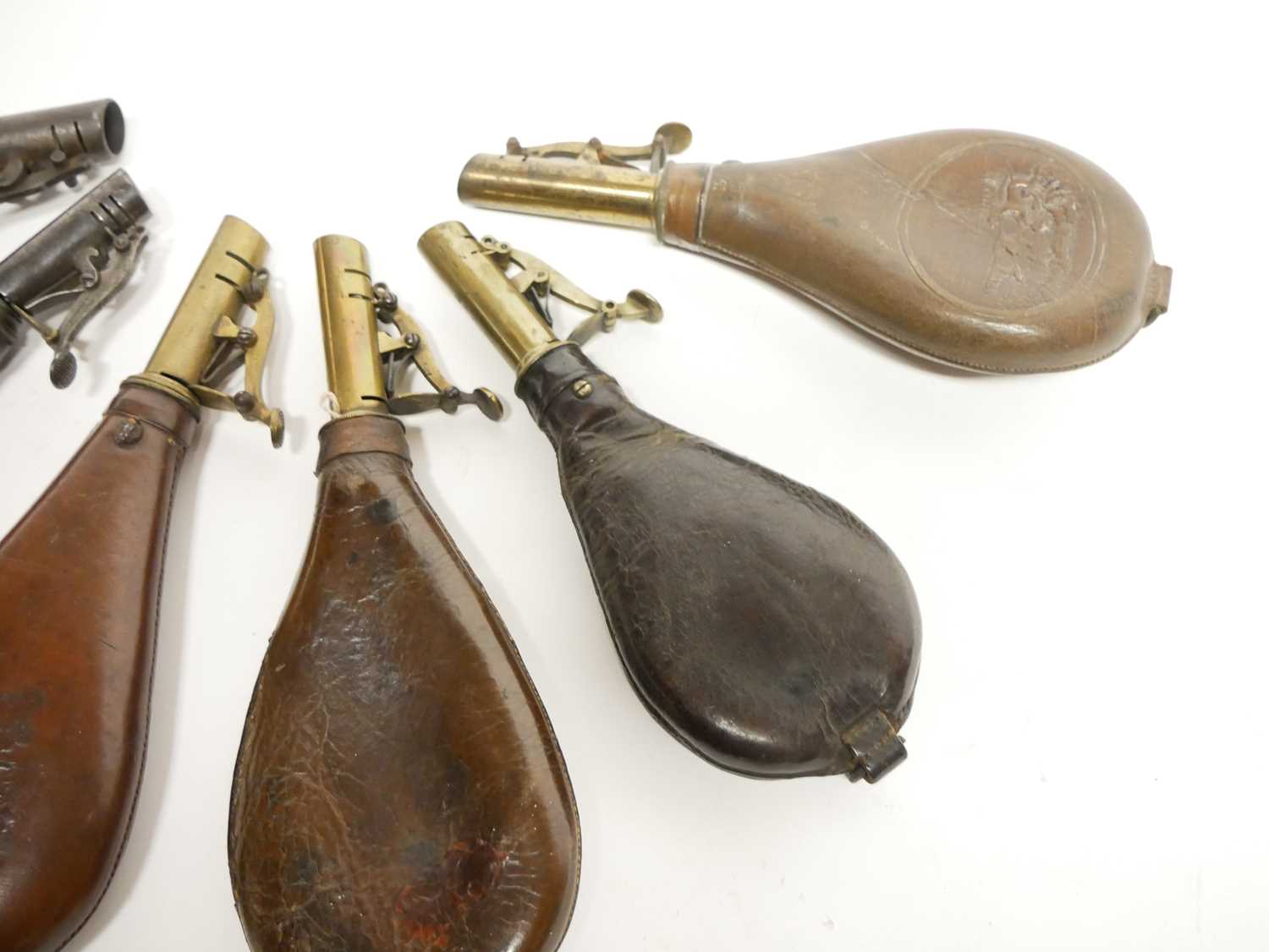 Lot 459 - Six leather shot flasks