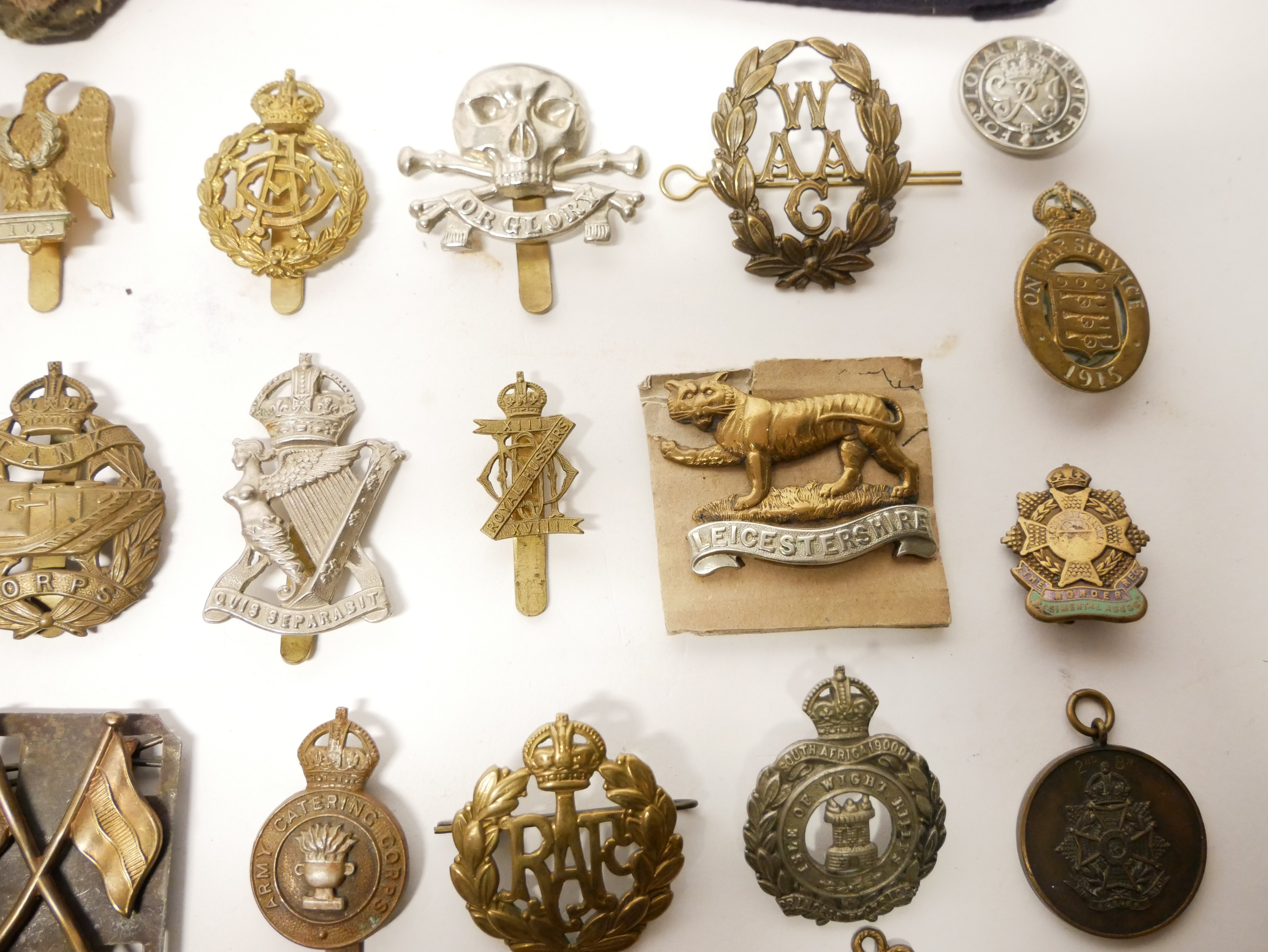 Lot 488 - Collection of cap badges, WWII medals and