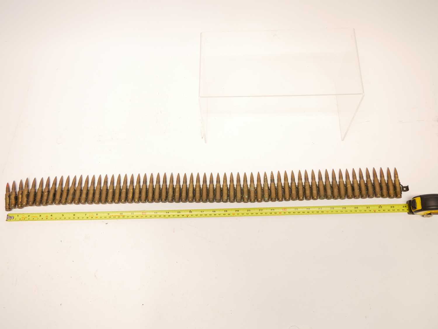 Lot 317 - Machine gun belt of 59 7.62 inert rounds
