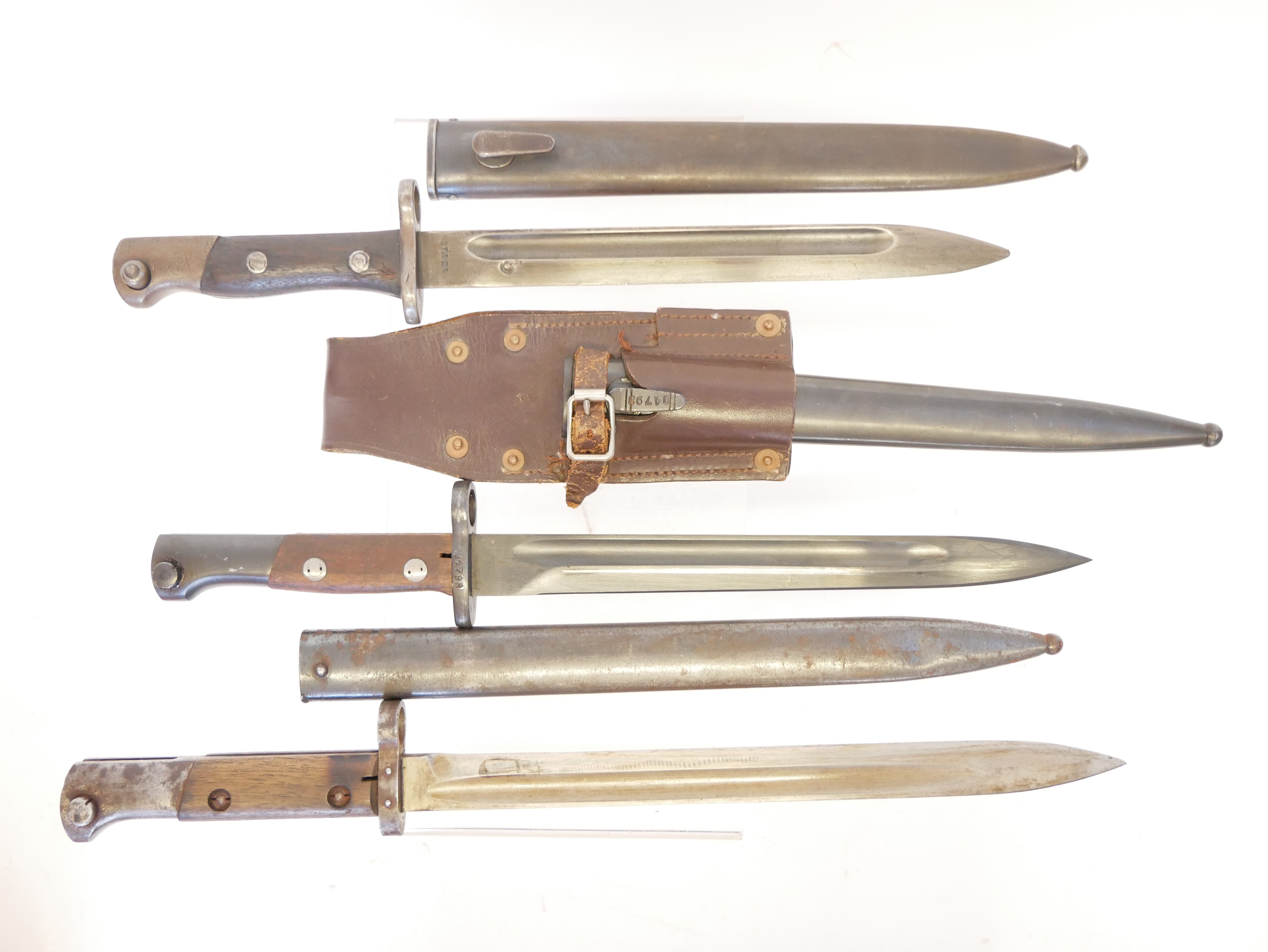 Lot 265 - Three Mauser rifle bayonets and scabbards.