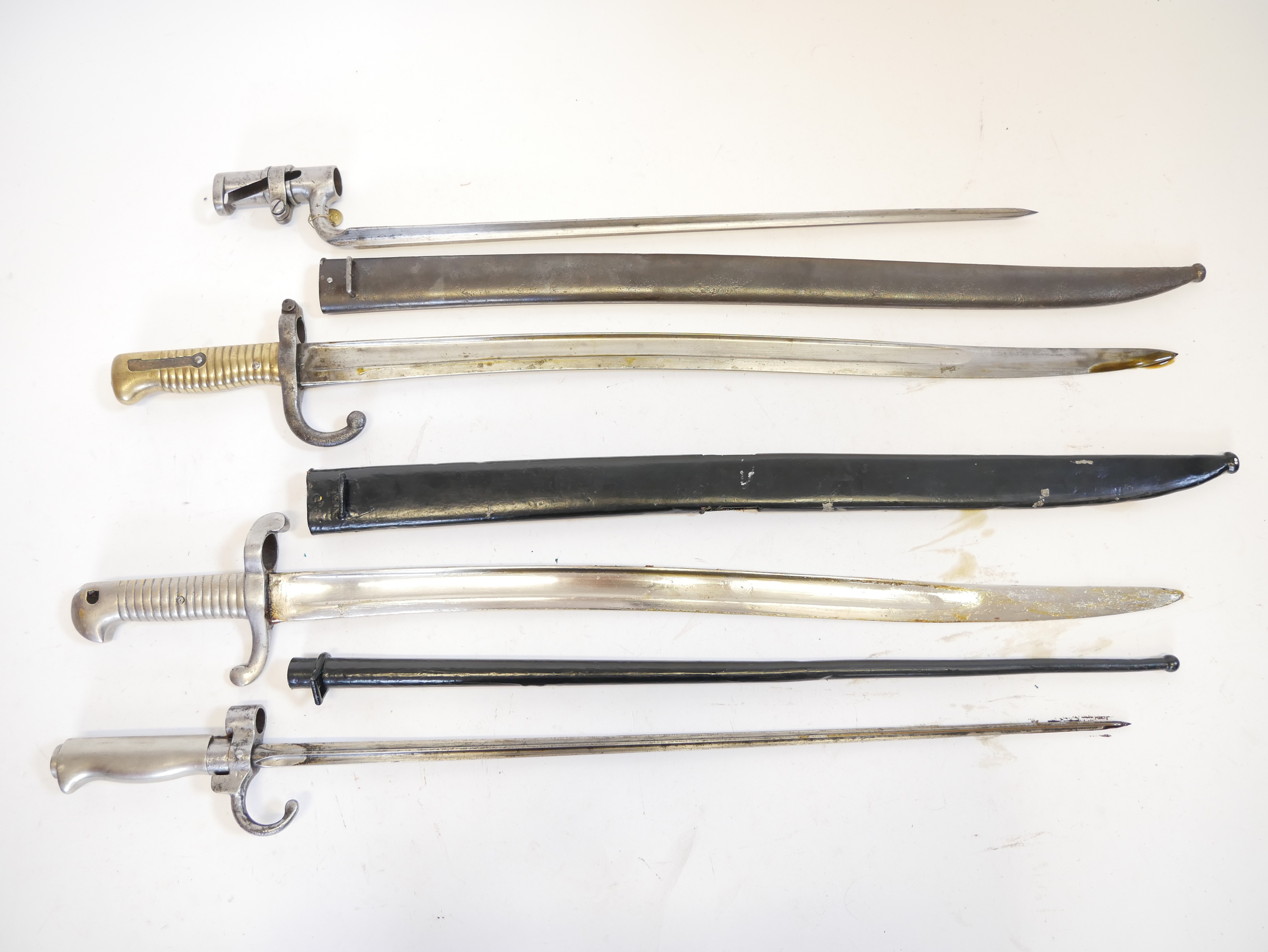 Lot 221 - Three French bayonets and scabbards and a