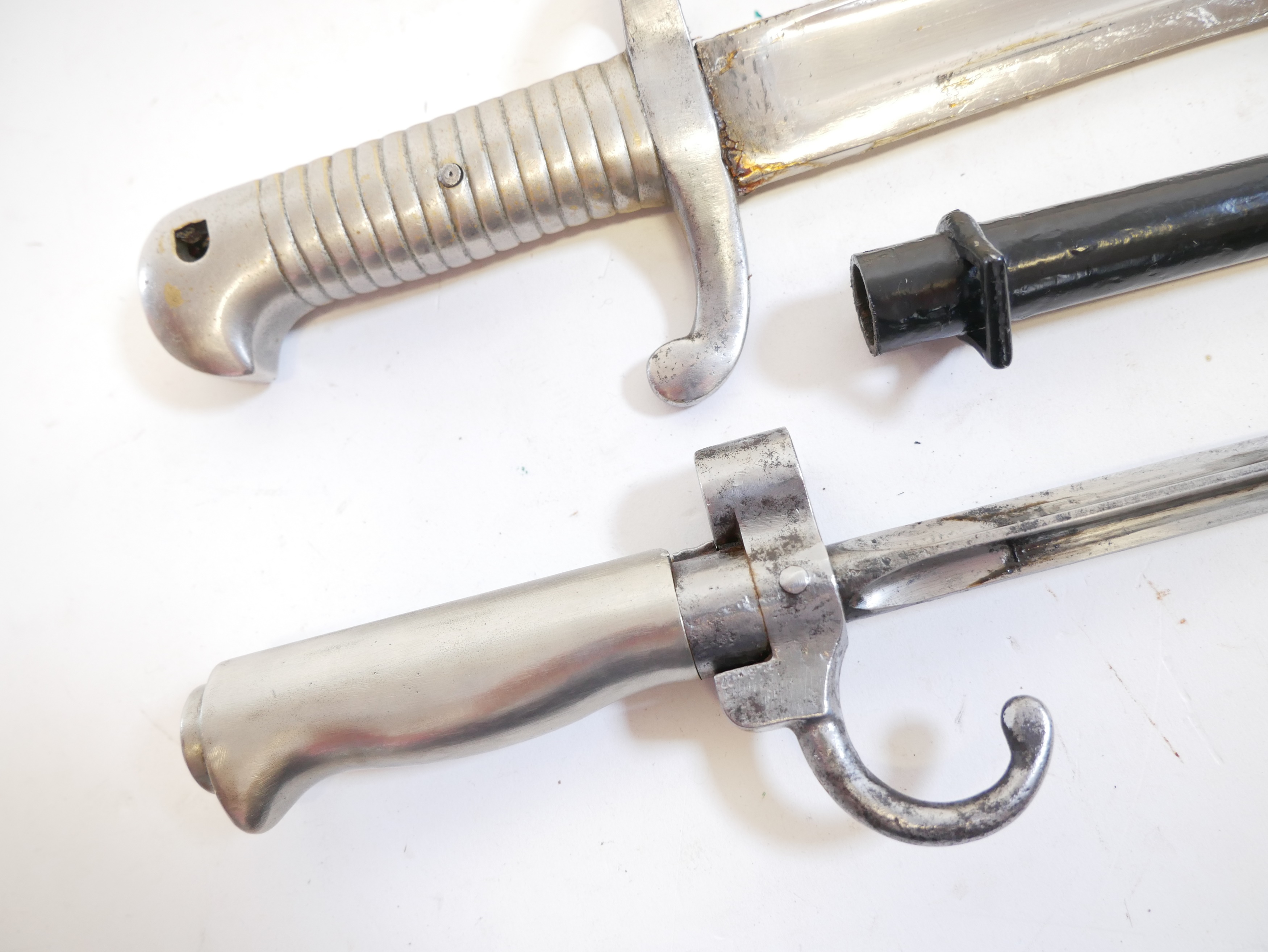 Lot 221 - Three French bayonets and scabbards and a