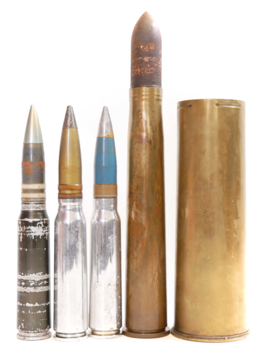 Lot 231 - Four inert artillery rounds and a shell case.