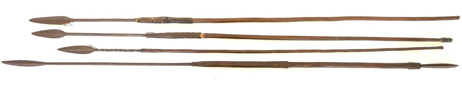 Lot 115 - Four African throwing spears. Buyer must be