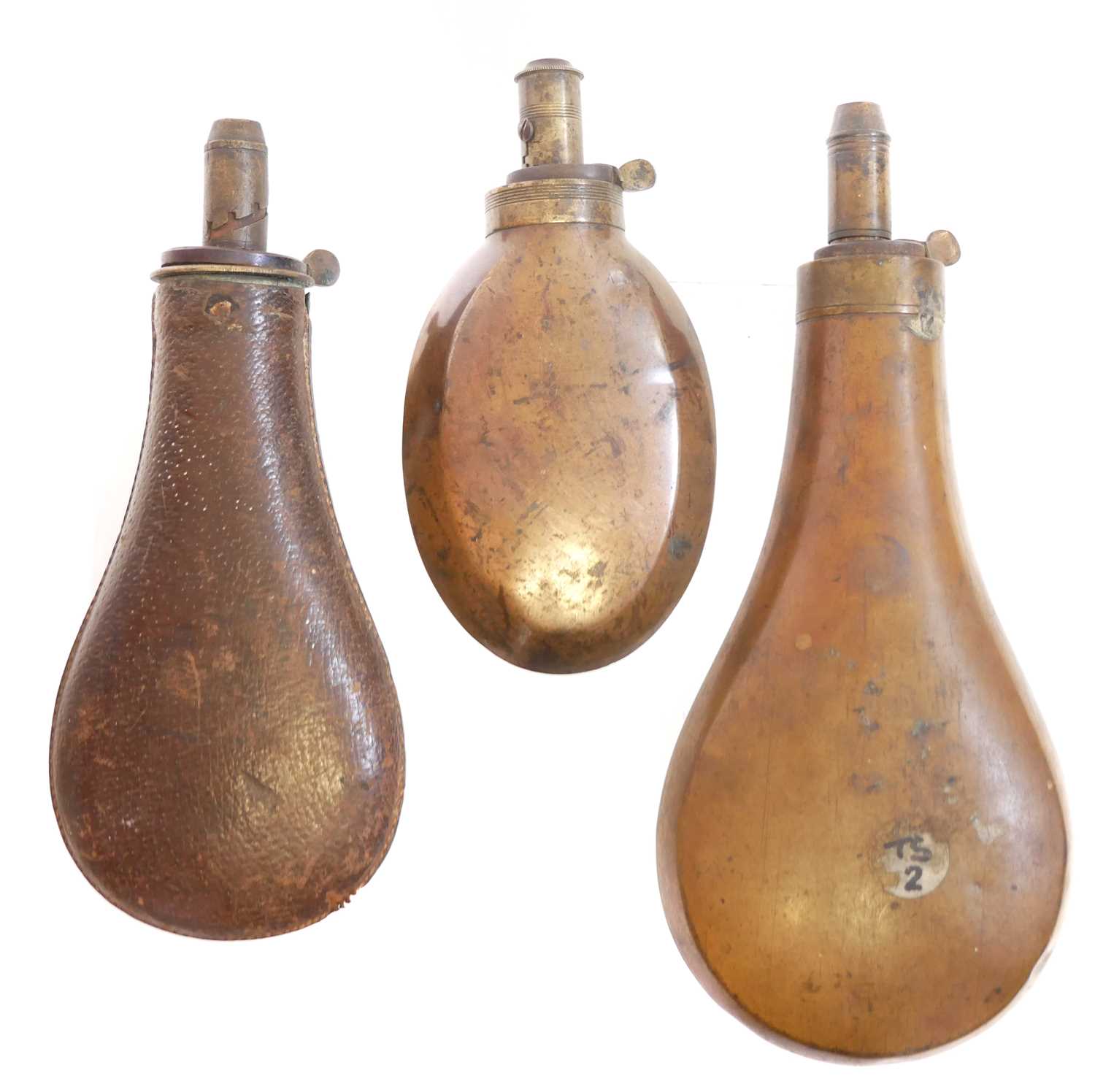 Lot 382 - Two copper and brass powder flasks and a