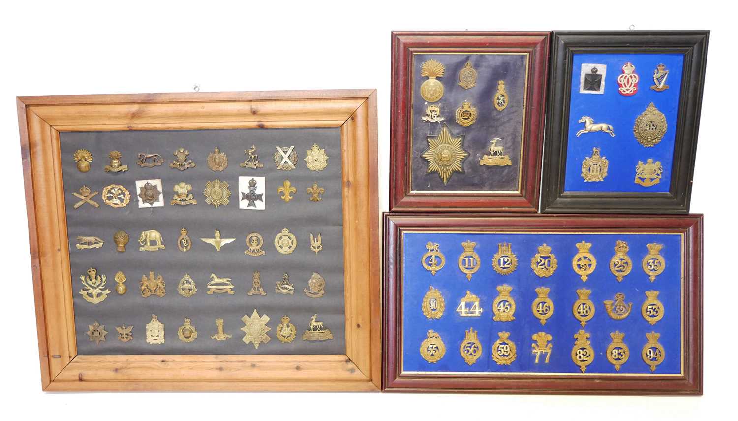 Lot 265 - Four framed cap badge displays, a mix of