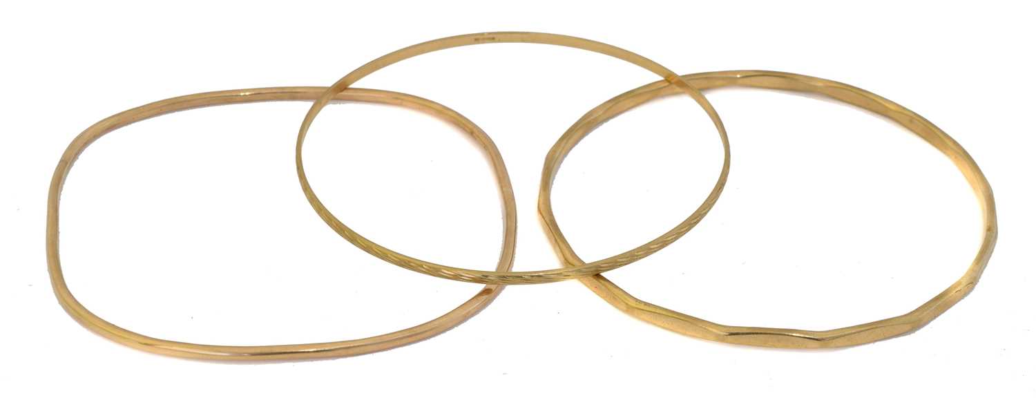 Lot 47 - Three bangles.