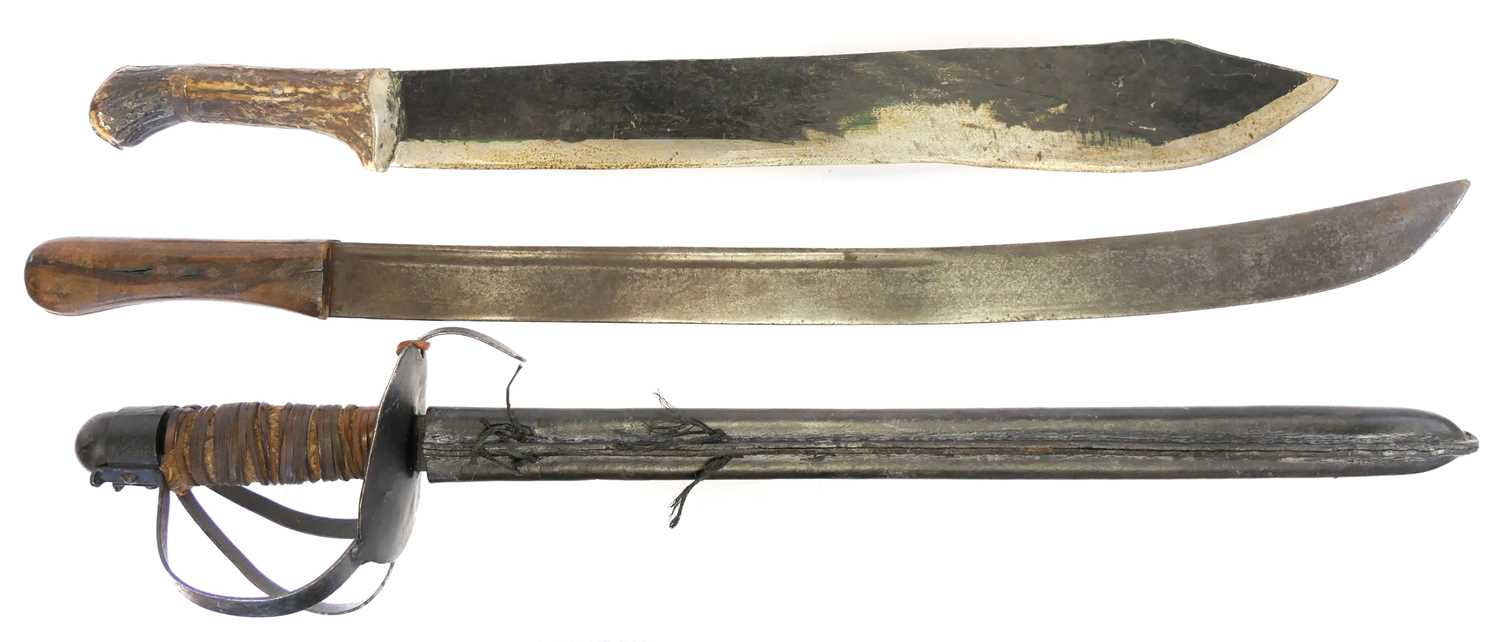 Lot 172 - Two machettes, one with curved fullered Lot 172 - Two machettes, one with curved fullered