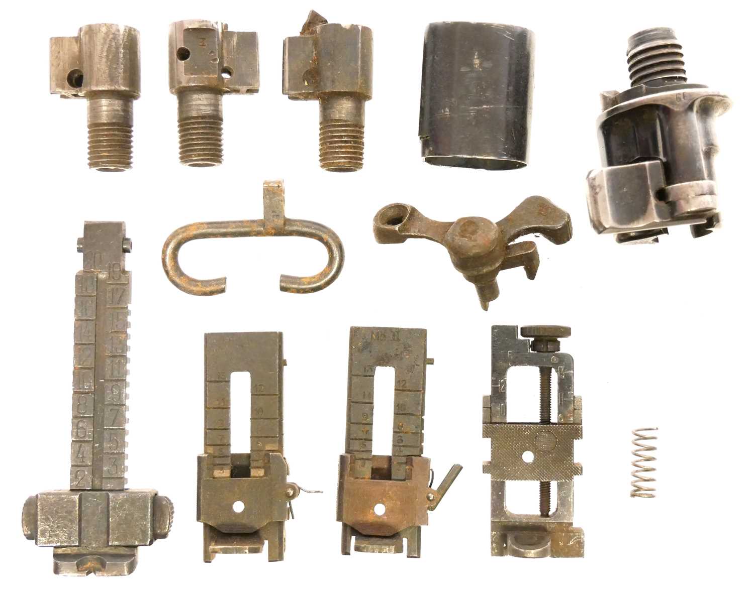 Lot 714 - Three No.4 Lee Enfield rifle bolt heads