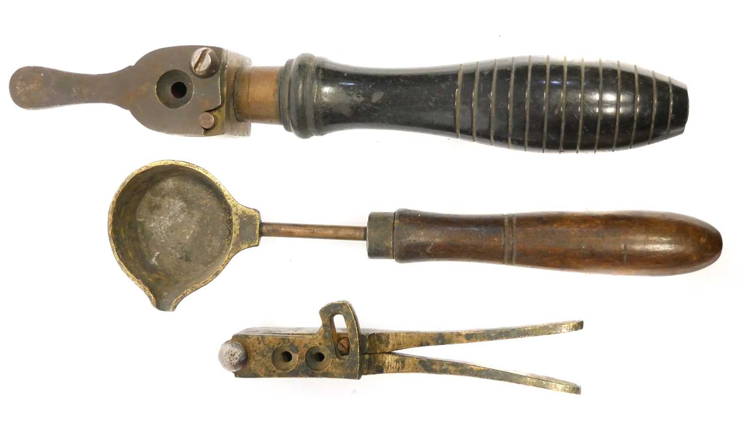 Lot 139 - Two bullet moulds and a lead pouring ladle,