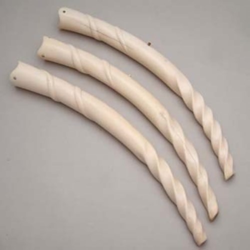 Lot 162 - Set of three tusks carved with snakes.