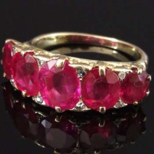 Lot 252 - Five stone ruby ring.