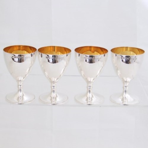 Lot 259 - Four silver small goblets
