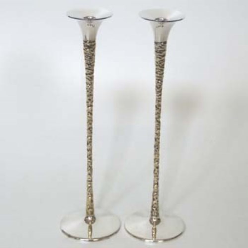 Lot 239 - A pair of silver candlesticks by Stuart